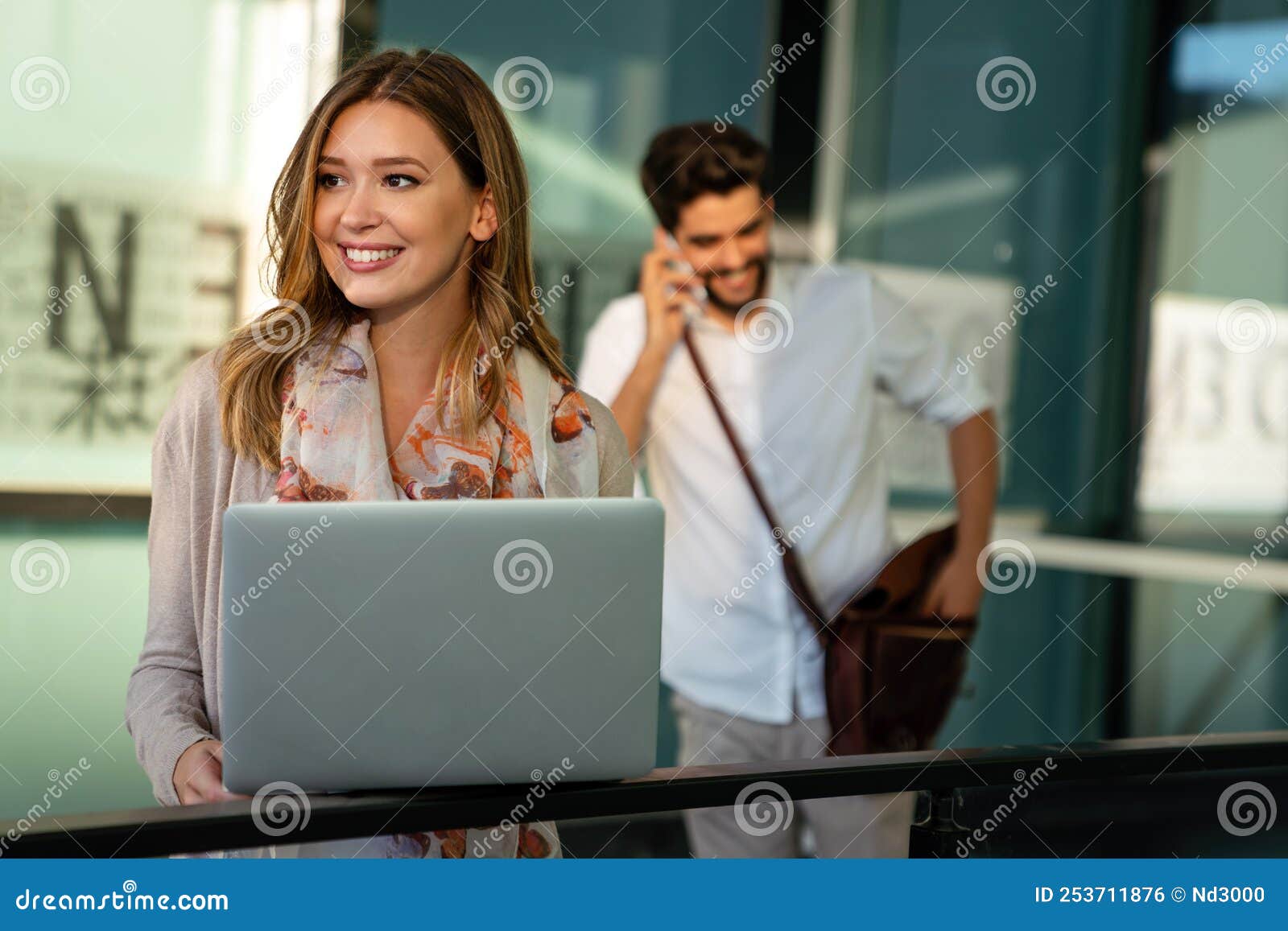 Two Young Successful Business Colleagues Talking, Working Together ...