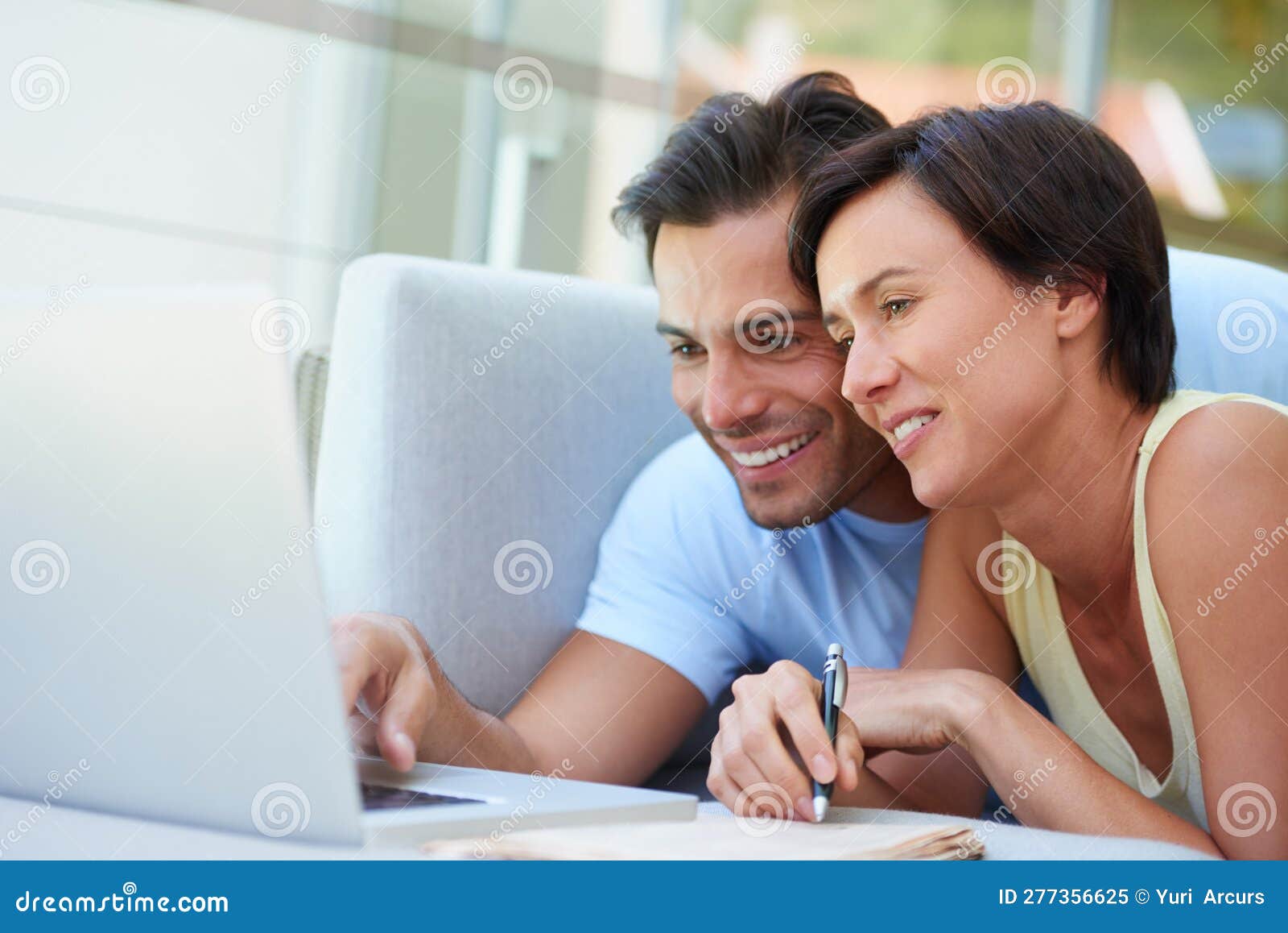 Working Together on Their Finances. a Married Couple Working on Their ...