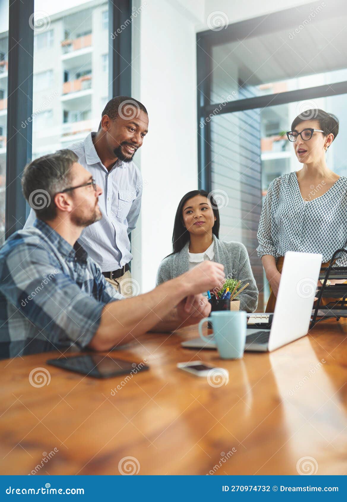 Working Together To Get the Task Done. Shot of Businesspeople Working ...