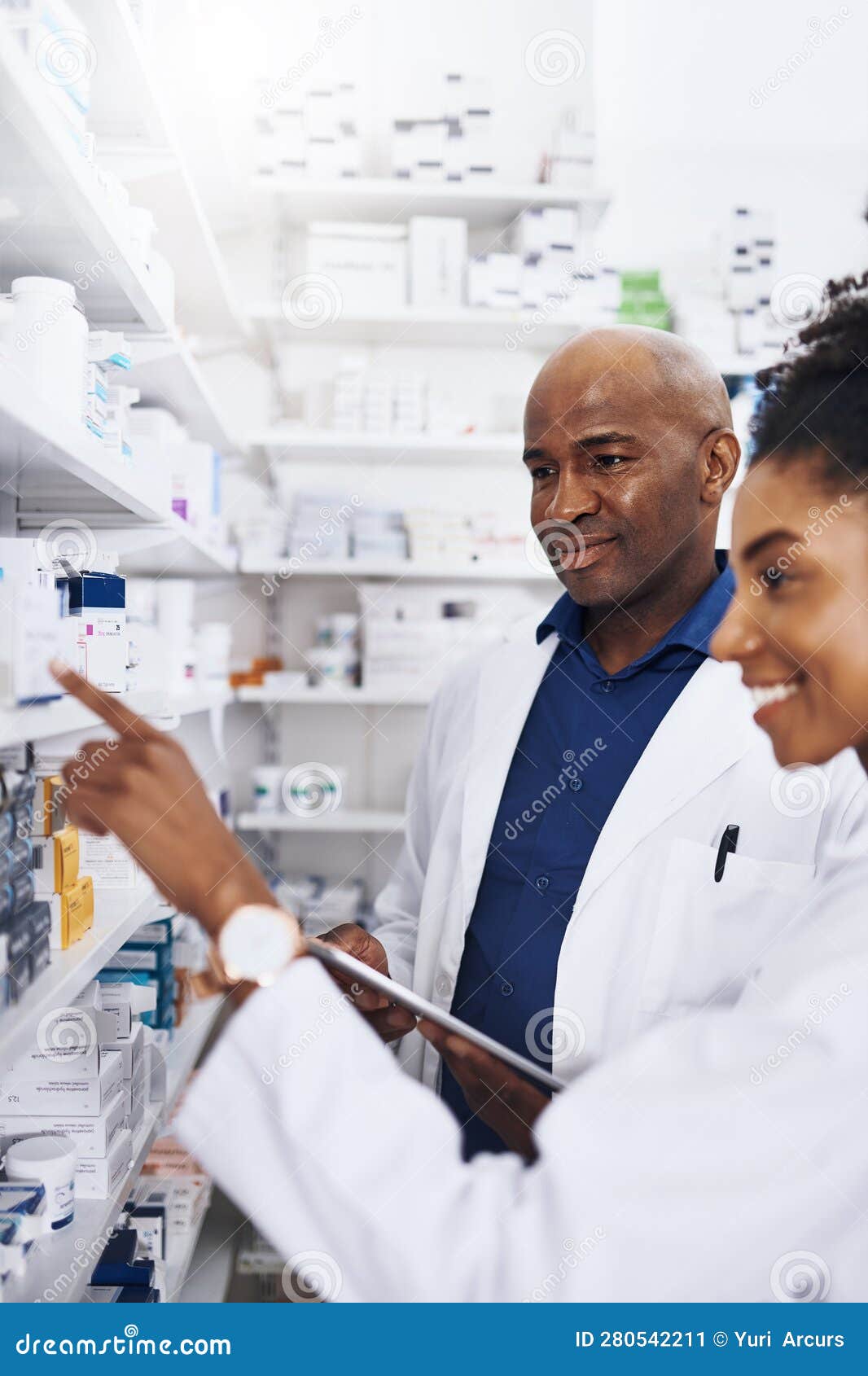 Working Together for Your Wellbeing. Two Pharmacists Doing Inventory in ...