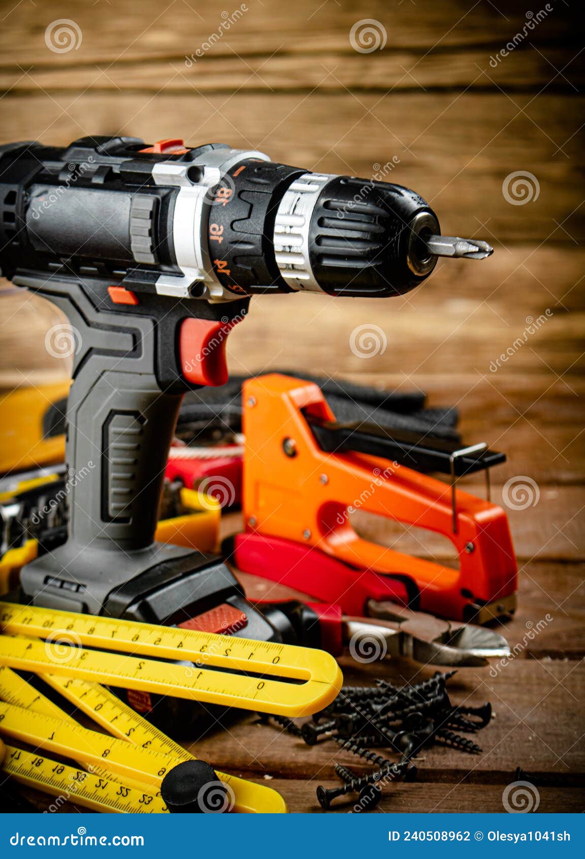 Working Tool. Screwdriver with Self-tapping Screws on the Table Stock ...