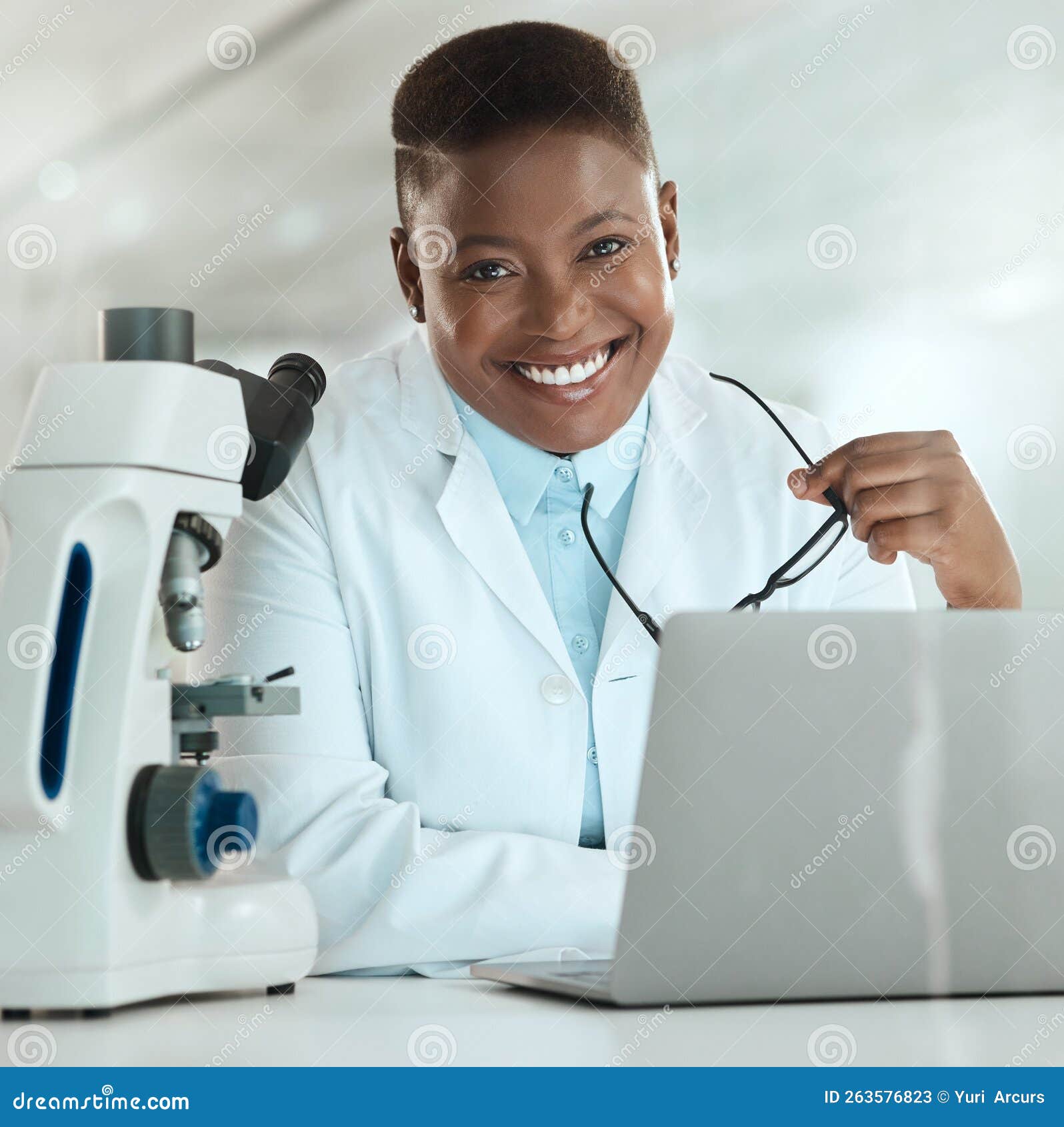 Working Towards a Better Future. an Attractive Young Scientist Sitting ...