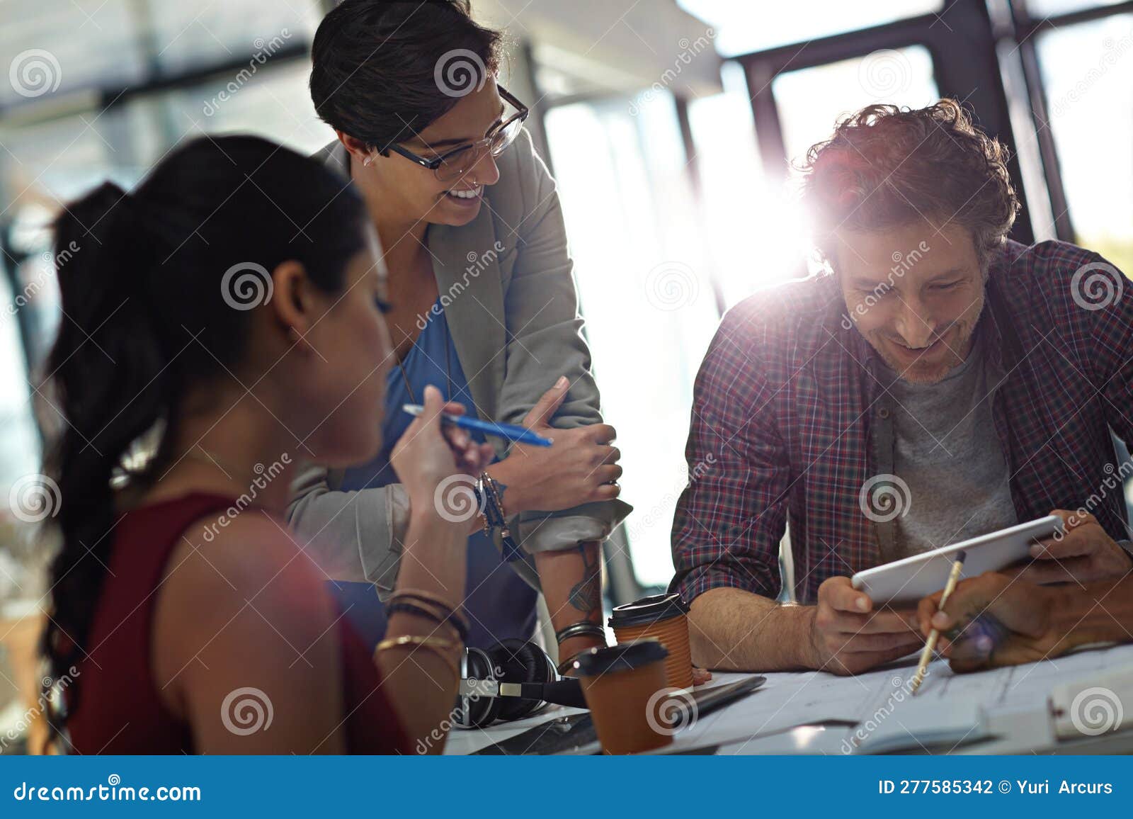 Working Towards a Common Goal. a Group of Colleagues Meeting in the ...