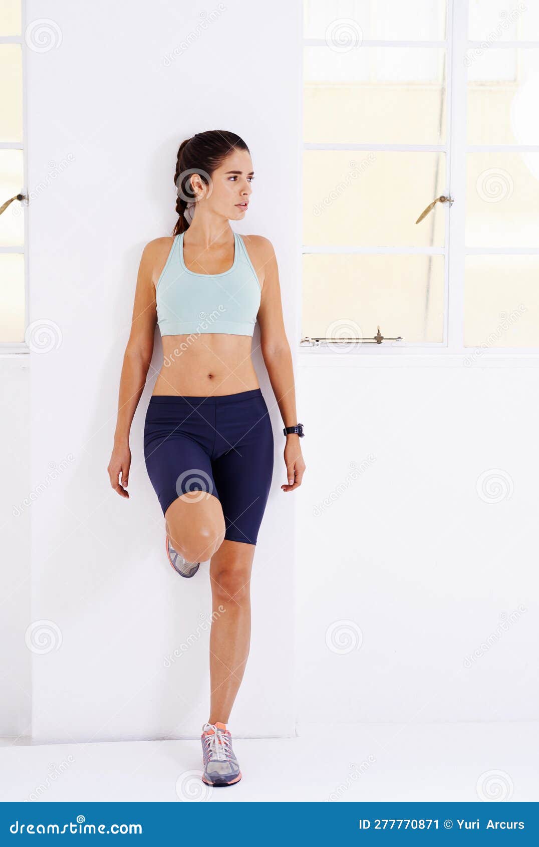 Working Up a Sweat. Studio Shot of an Attractive Young Woman Working ...