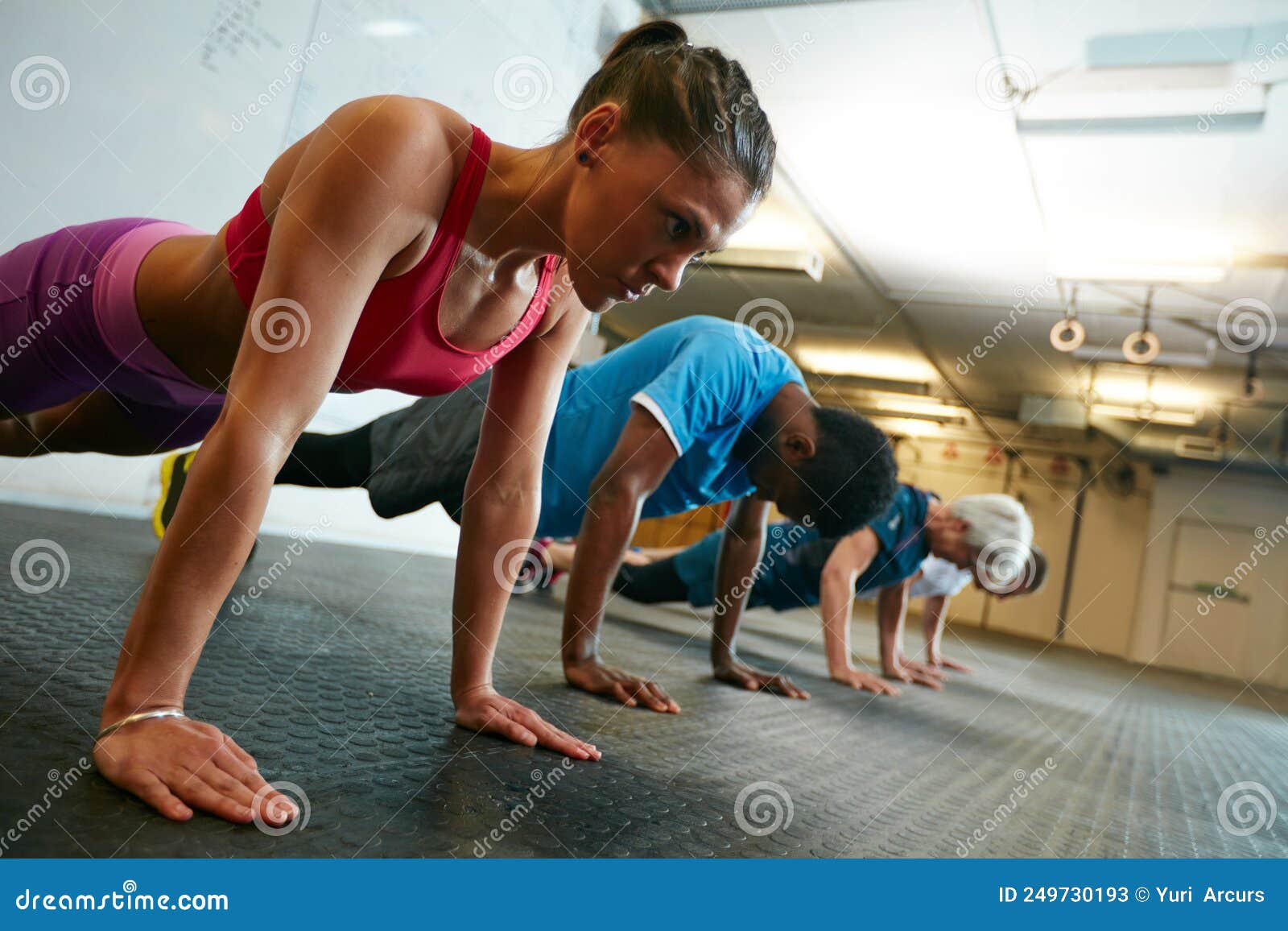 Working the Upper Body. Shot of a Group of People Working Out in the ...