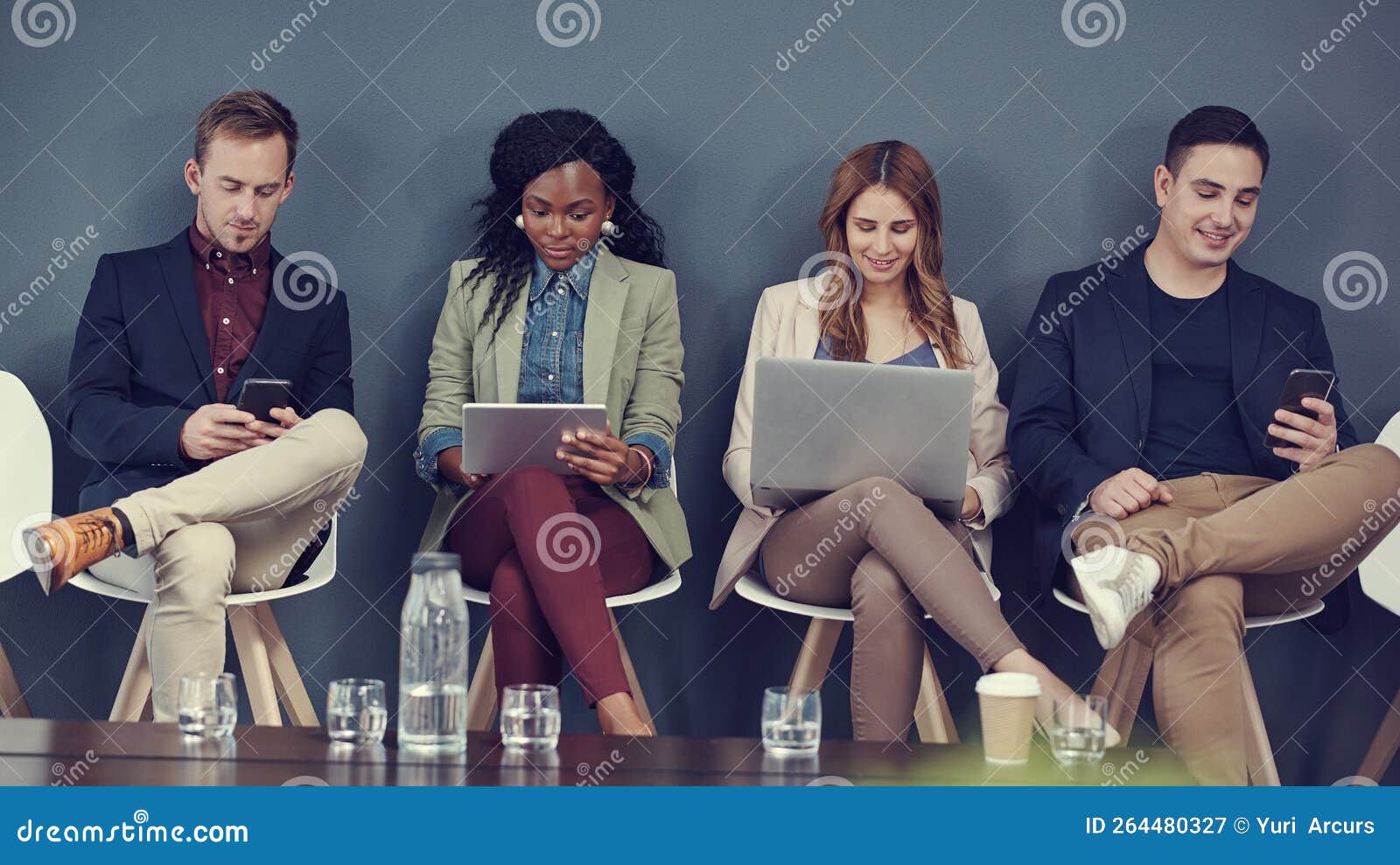 Working while we Waiting. a Group of Businesspeople Using Different ...