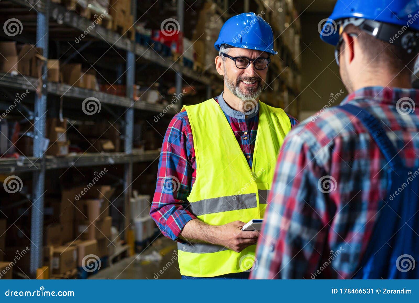 Working in Warehouse, Managers and Workers Checking Inventory. Stock ...