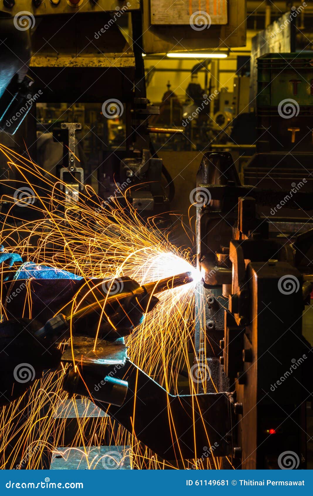 The Working Welder Performs Welding Work In Production Using Electric ...