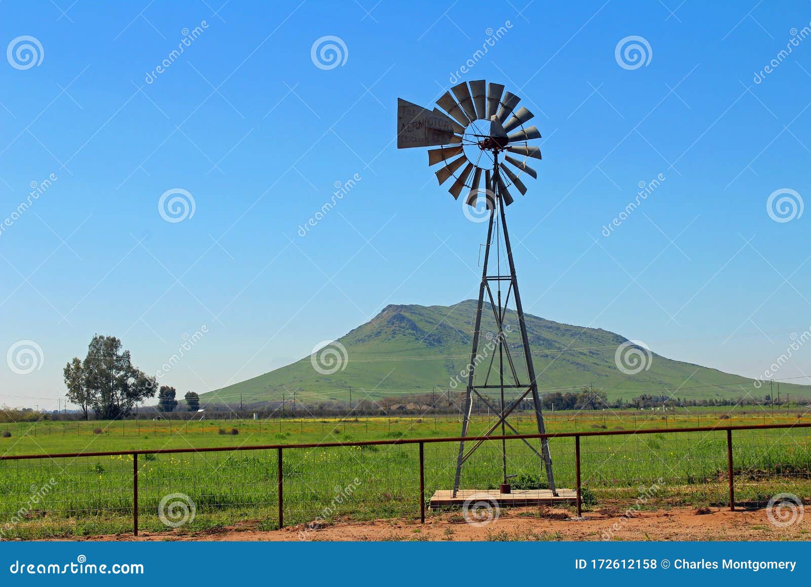 Working Windmill CA 07433 stock photo. Image of fence - 172612158