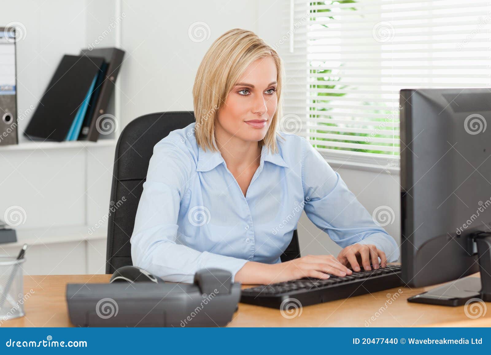 Working Woman in Front of a Screen Stock Photo - Image of keyboard ...
