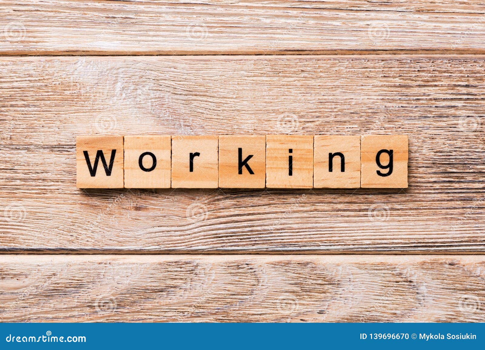 WORKING Word Written on Wood Block. WORKING Text on Wooden Table for ... WORKING Word Written on Wood Block. WORKING Text on Wooden Table for ...
