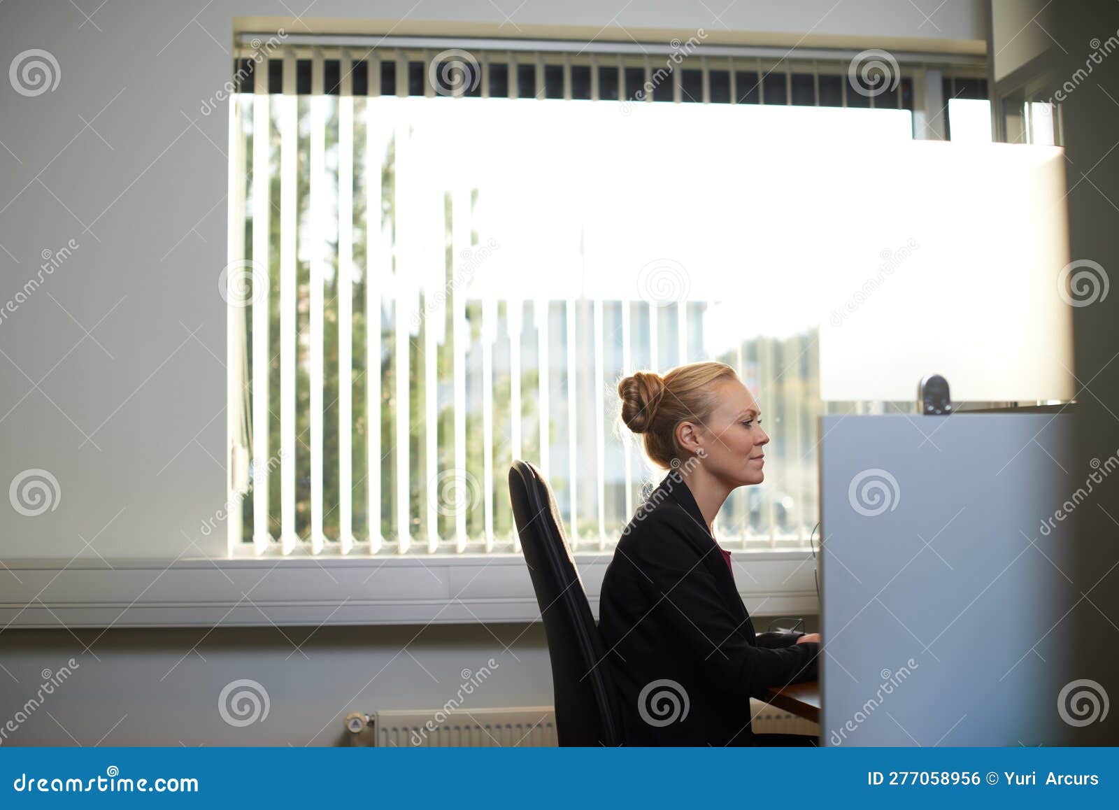 Working with Zero Distractions. an Attractive Businesswoman Using Her ...