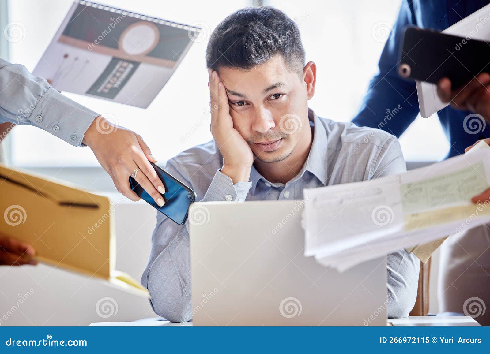 The Workload Just Doesnt End. a Young Businessman Looking Stressed Out ...