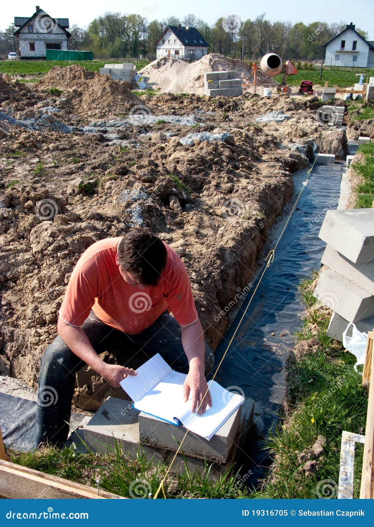 Workman on building site stock image. Image of planning - 19316705
