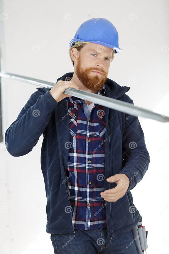 Workman Carrying Metal Frame Stock Photo - Image of site, employment: 332671076