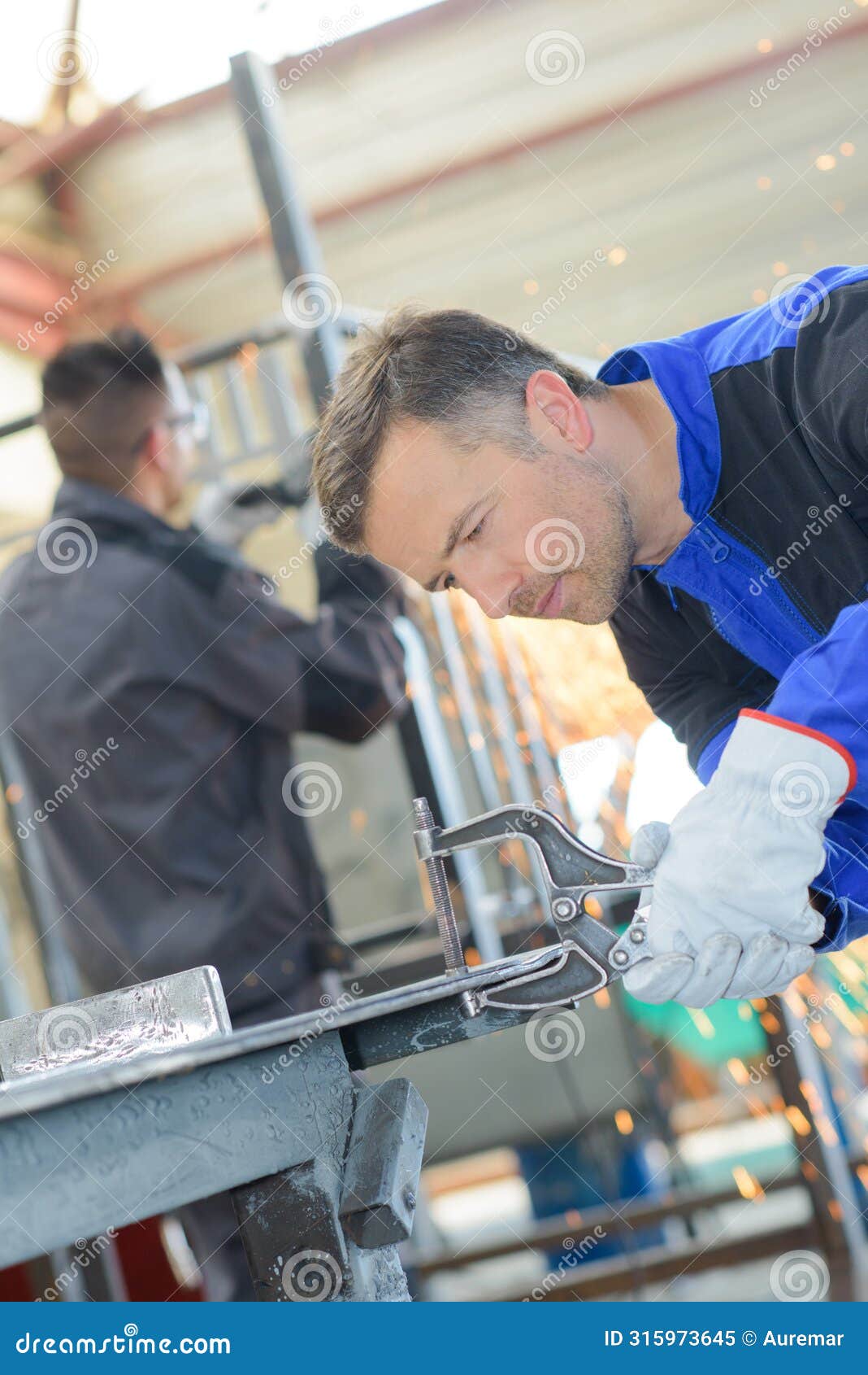 Workman Clamping Metal Onto Bench Stock Image - Image of manufacturing ...