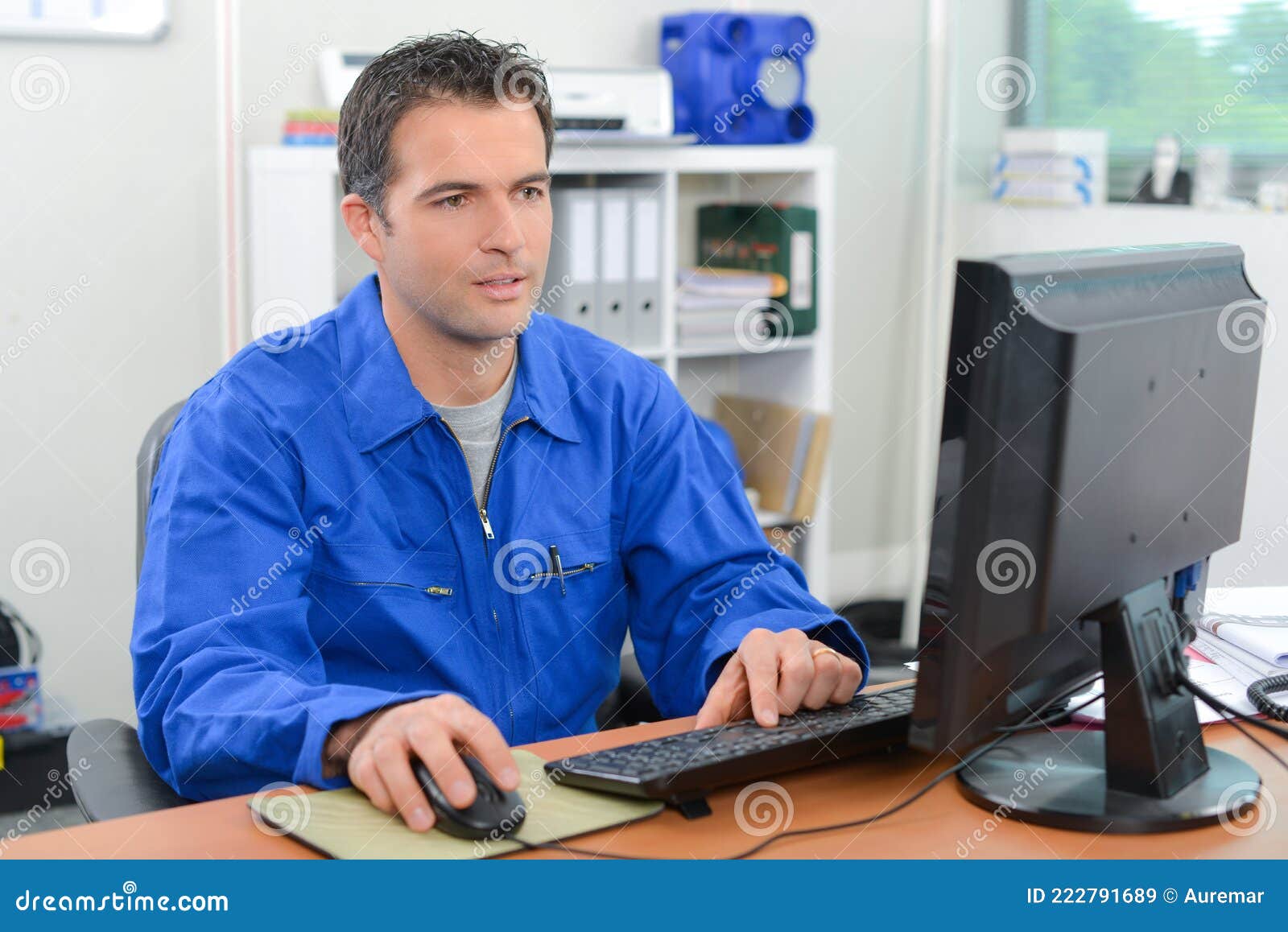 Workman on computer stock image. Image of placement - 222791689