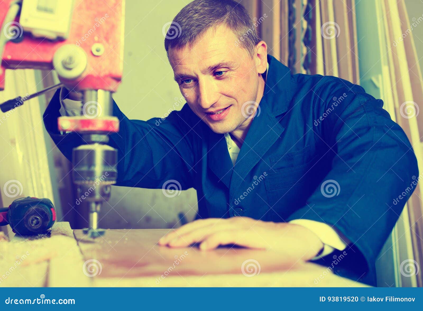 Workman drilling planks stock photo. Image of adult, material - 93819520