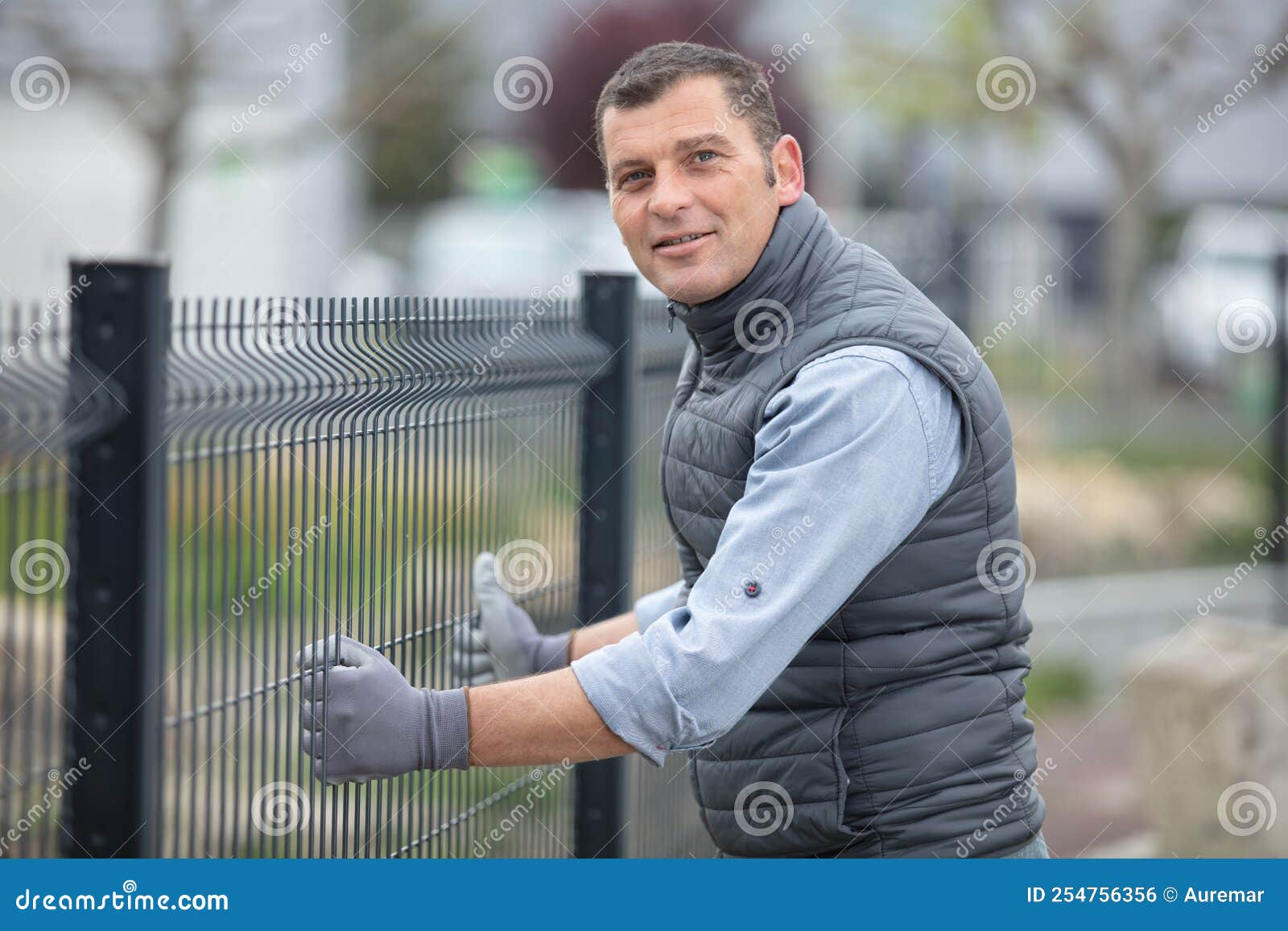 Workman Erecting Wire Fence Stock Photo - Image of service, industry ...