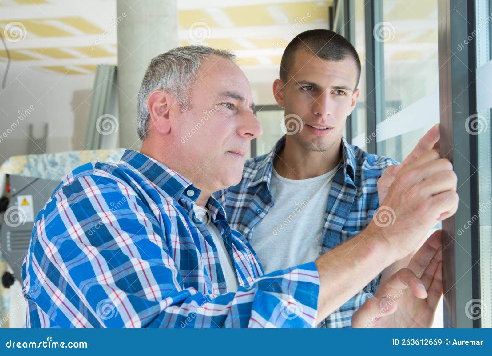 Workman Inspecting Window Frame Stock Image - Image of plaid ...