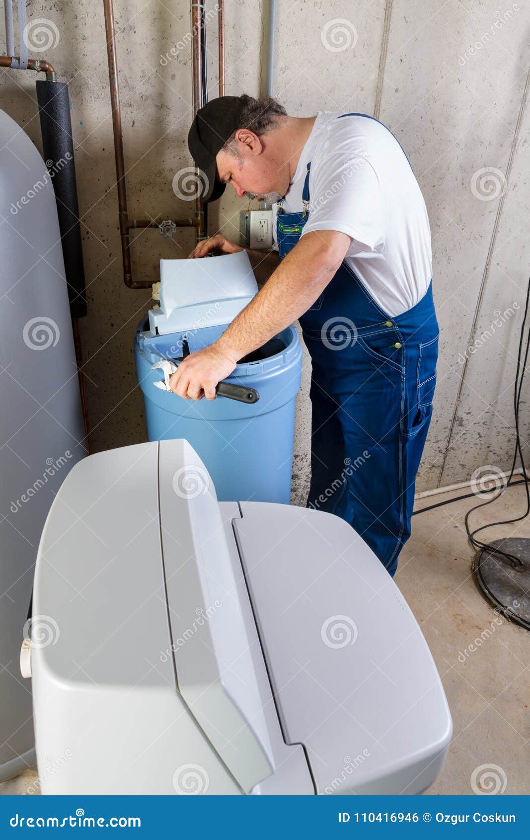 Workman Installing a Domestic Water Softener Stock Photo - Image of ...