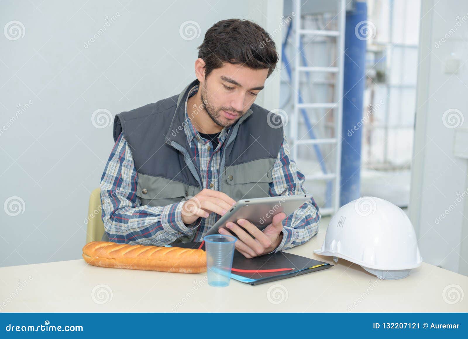 Workman on lunch break stock image. Image of bodywarmer - 132207121