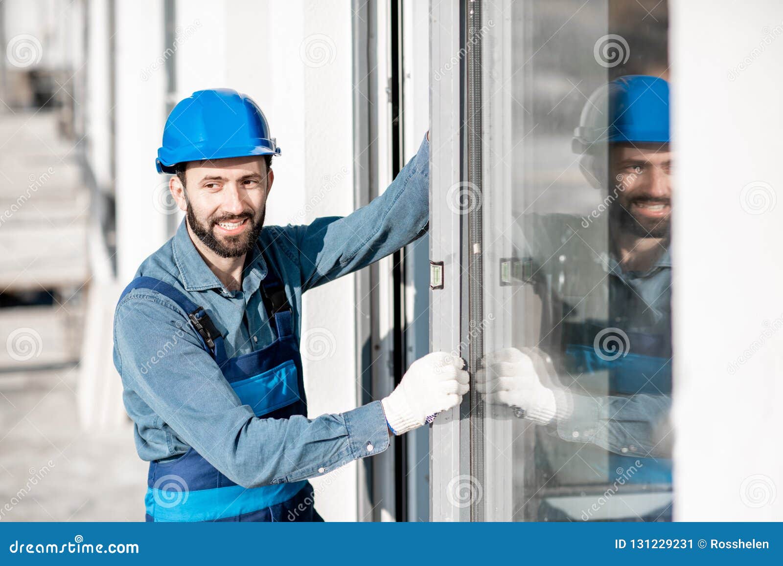 Workman mounting windows stock image. Image of male - 131229231