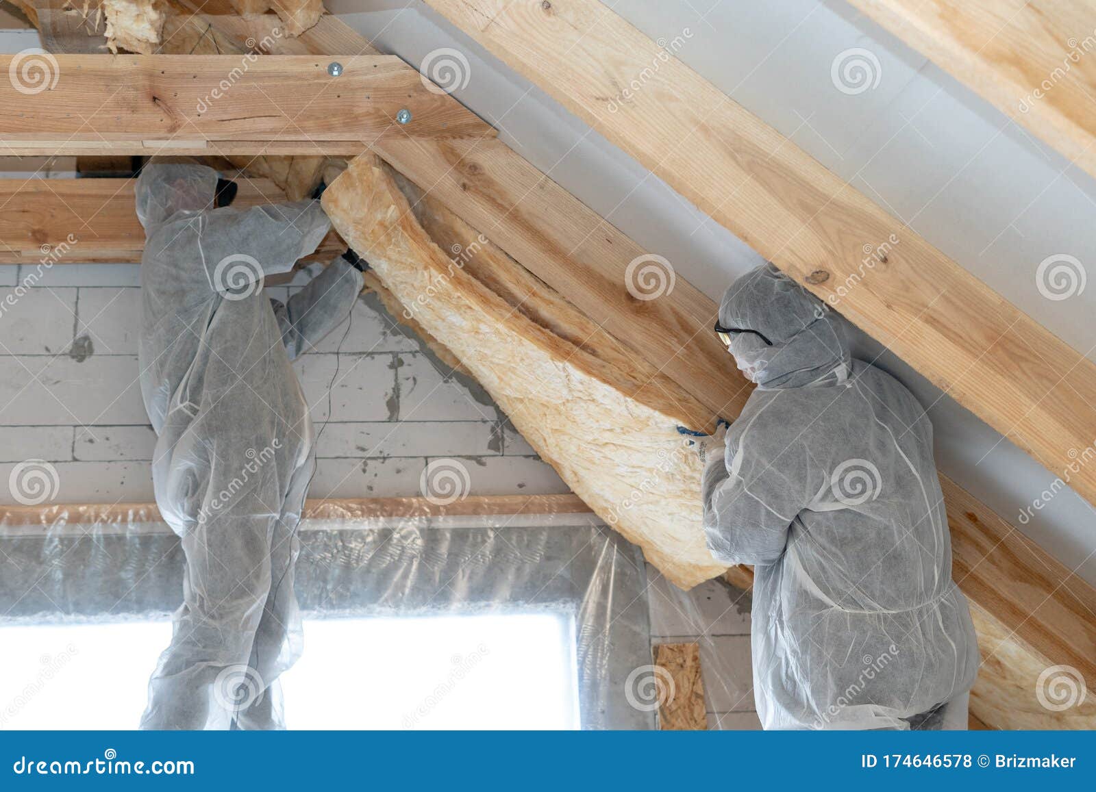 Workman in Overalls Working with Rockwool Insulation Material Stock ...