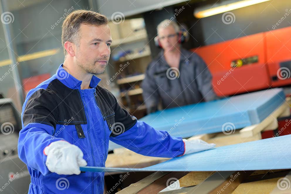 Workman Placing Sheet Materials on To Pallet Stock Photo - Image of ...