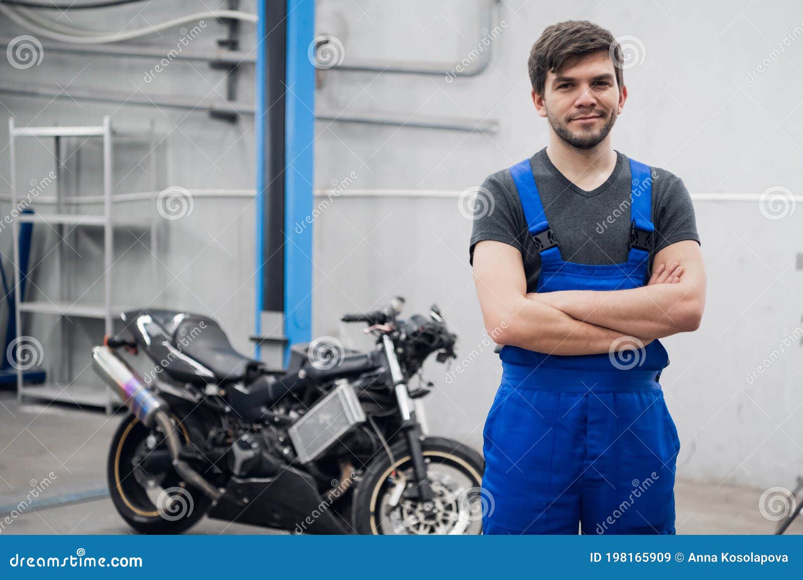 Workman Posing on Background with a Motorcycle Stock Image - Image of ...
