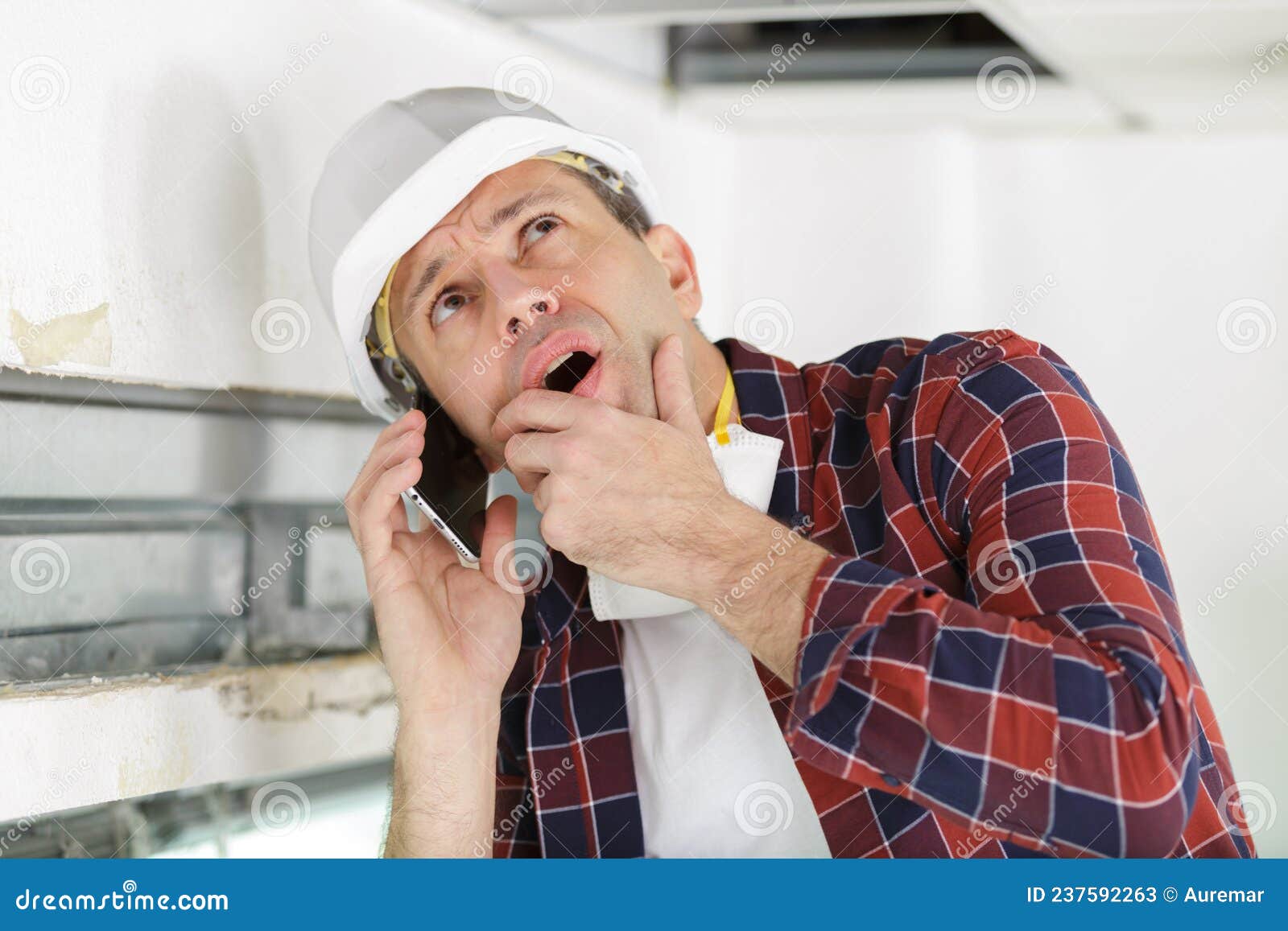 Workman in Property Looking Up in Dismay Stock Image - Image of person ...