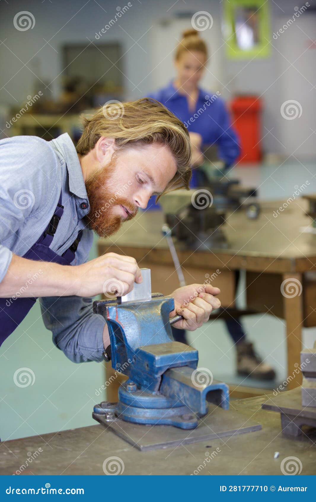 Workman Securing Metal in Vice Stock Photo - Image of dungarees, repair ...