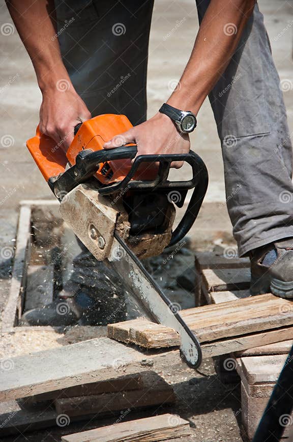 Workman using chainsaw stock photo. Image of equipment - 29053626