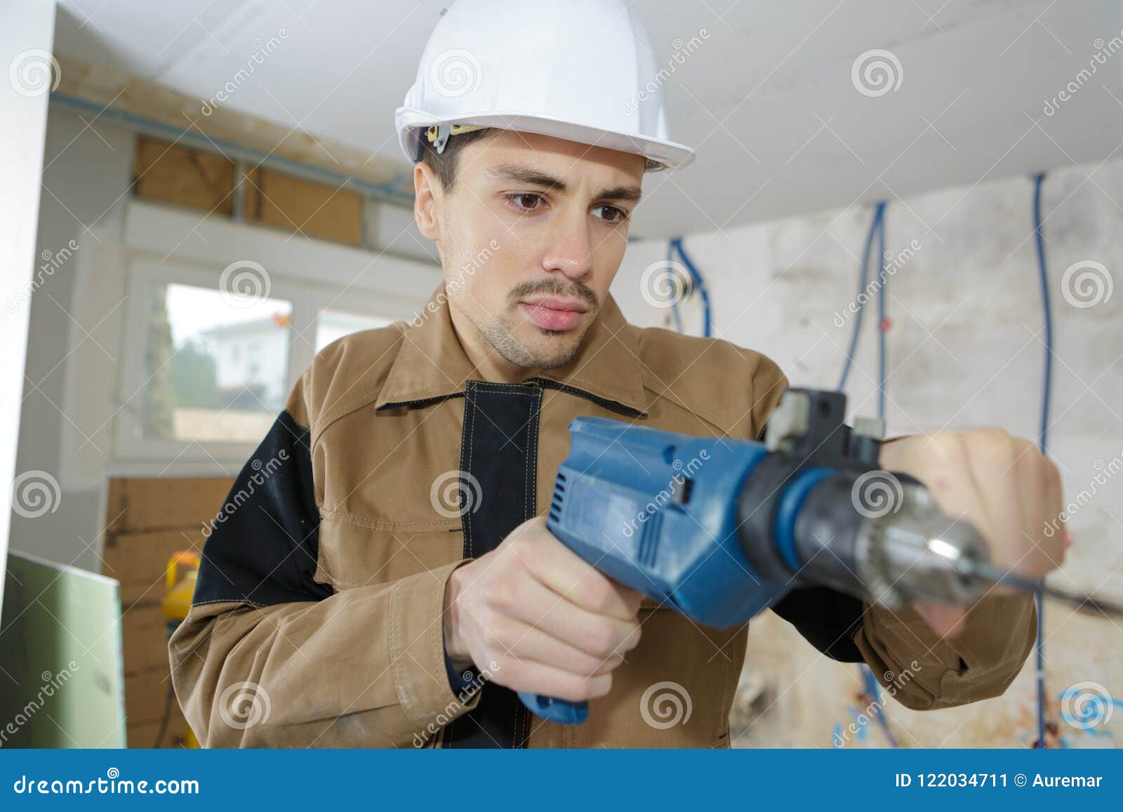 Workman Using Electric Drill Stock Image - Image of labor, equipment ...
