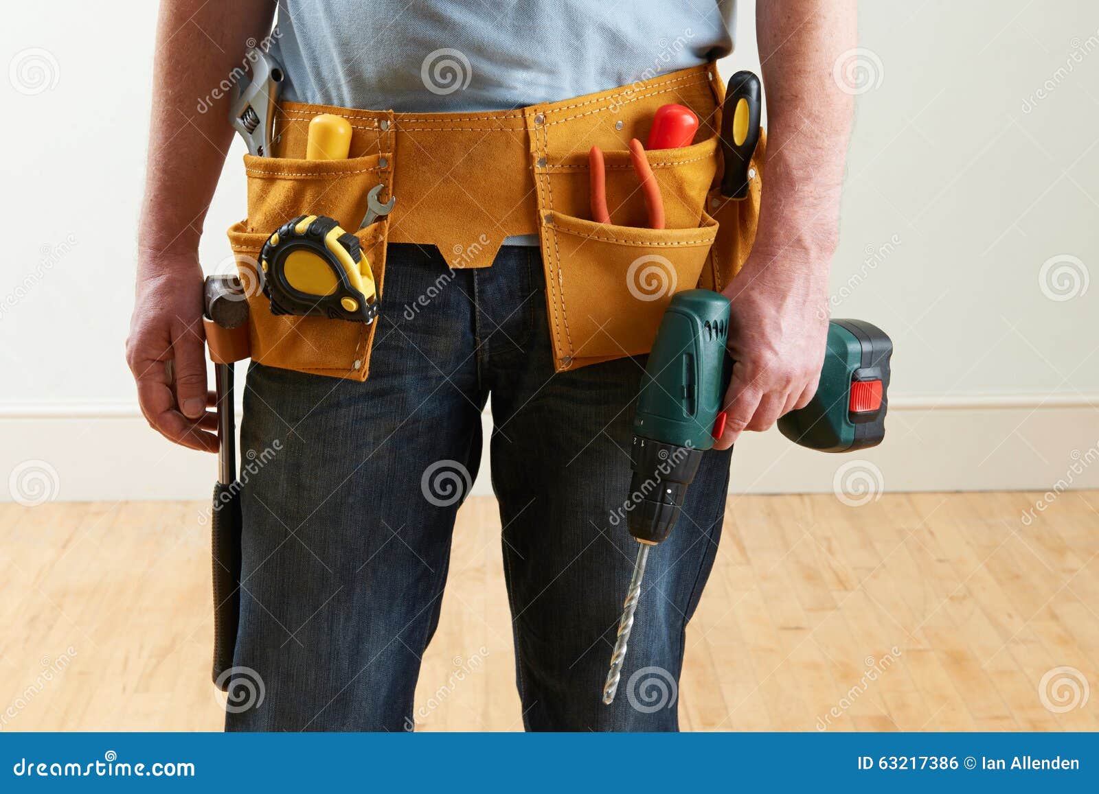 Workman Wearing Toolbelt stock photo. Image of drill - 63217386