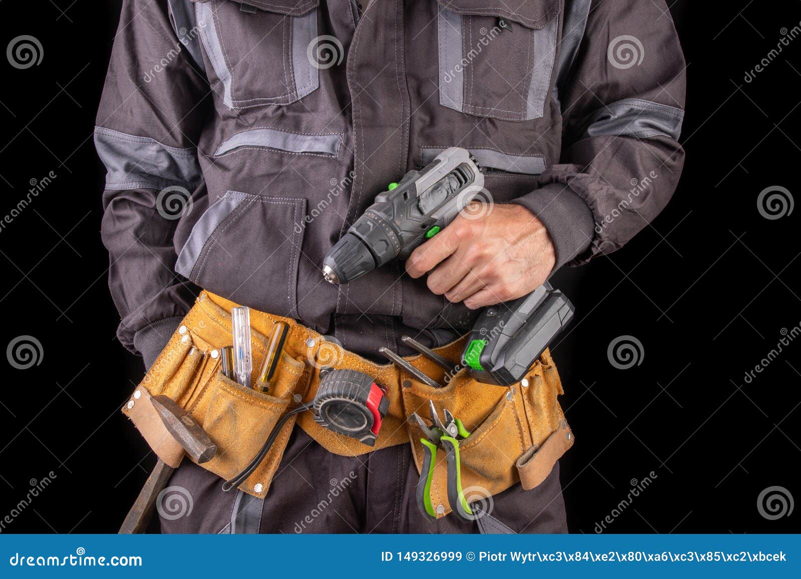 Workman in Work Clothes and Tool Belt. Production Worker with a Drill ...