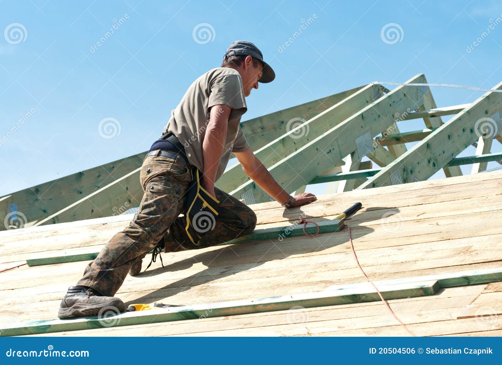 Workman working on roof stock photo. Image of background - 20504506