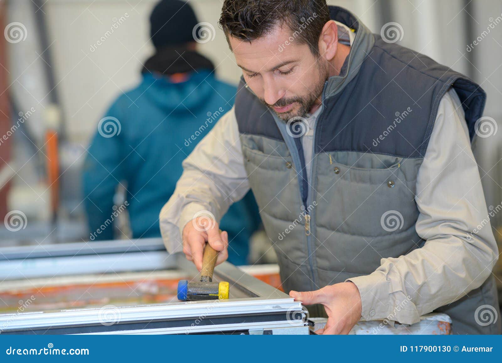 Workman Working on Window Frames at Factory Stock Photo - Image of ...