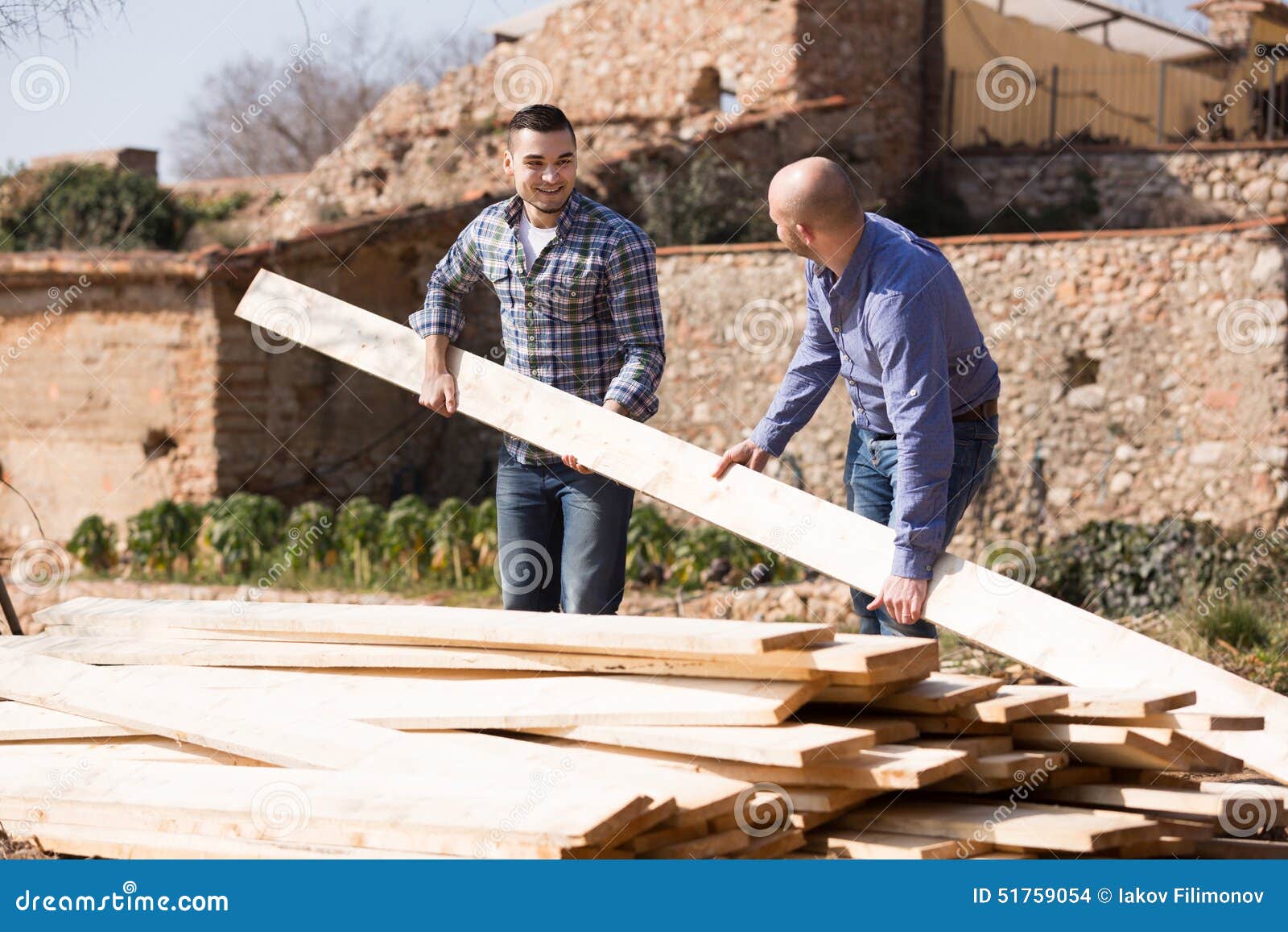Workmen Arranging Building Timber at Farm Stock Photo - Image of ...