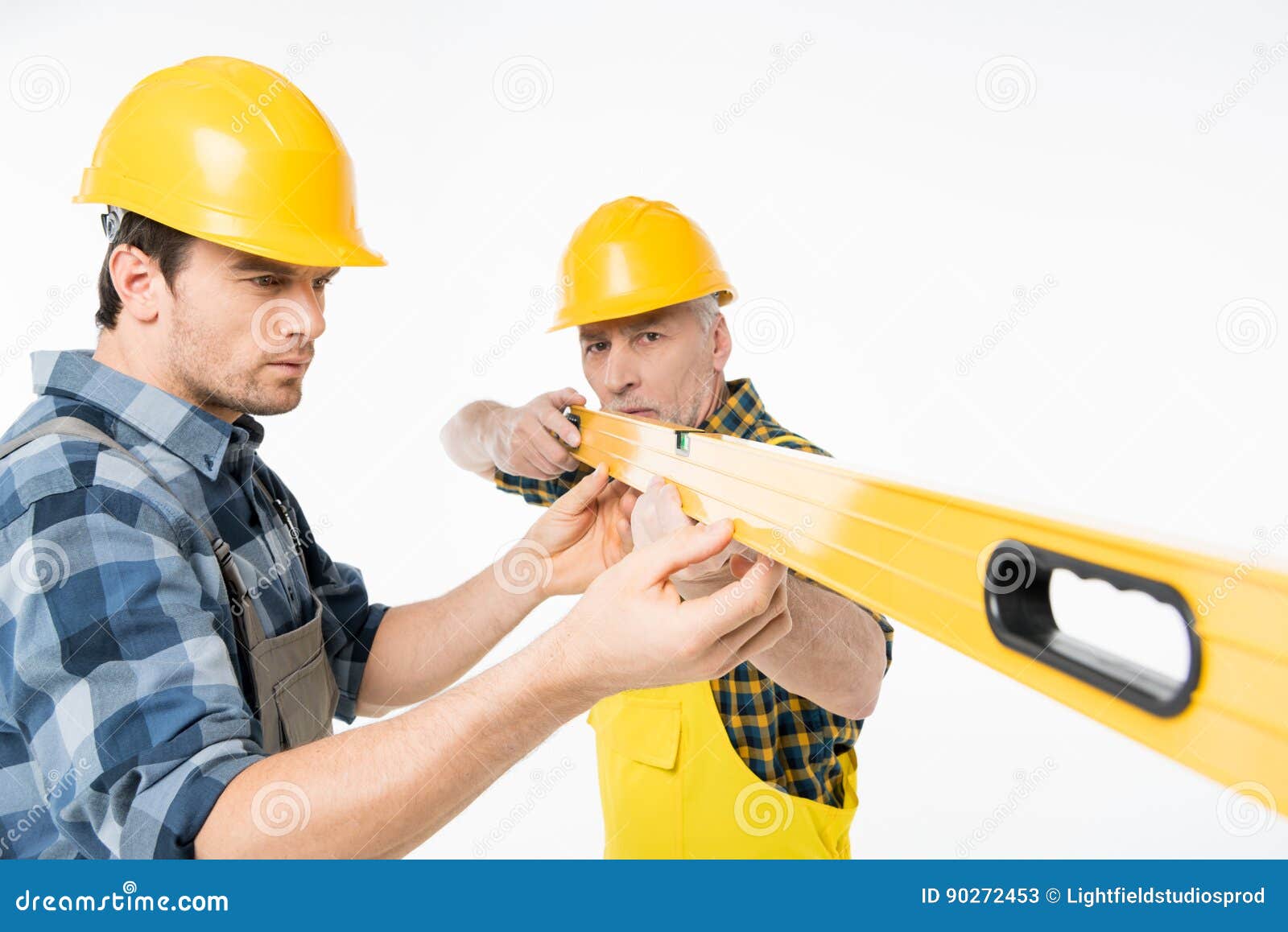 Workmen with level tool stock image. Image of safety - 90272453