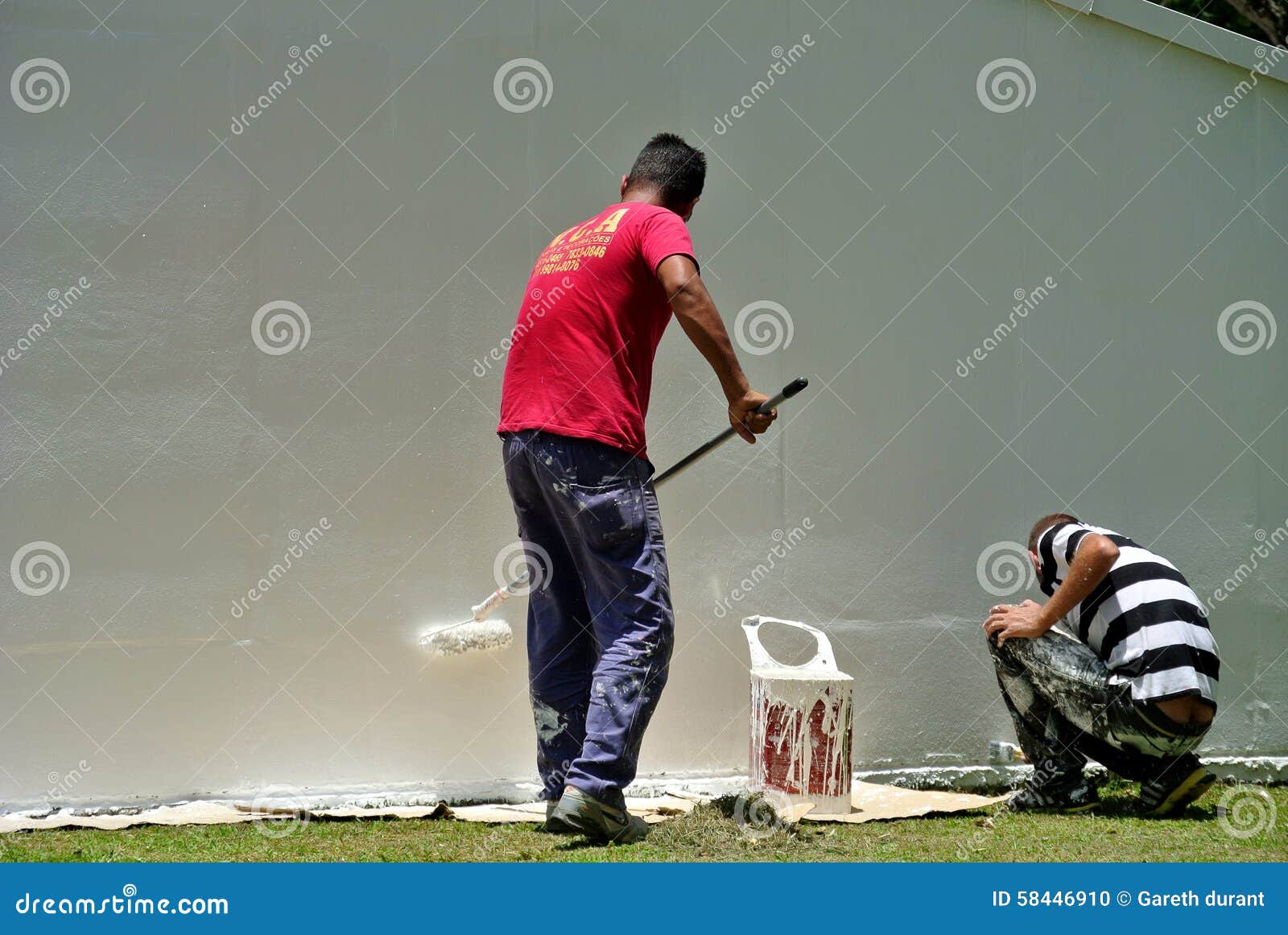 Workmen painting wall editorial image. Image of professional - 58446910