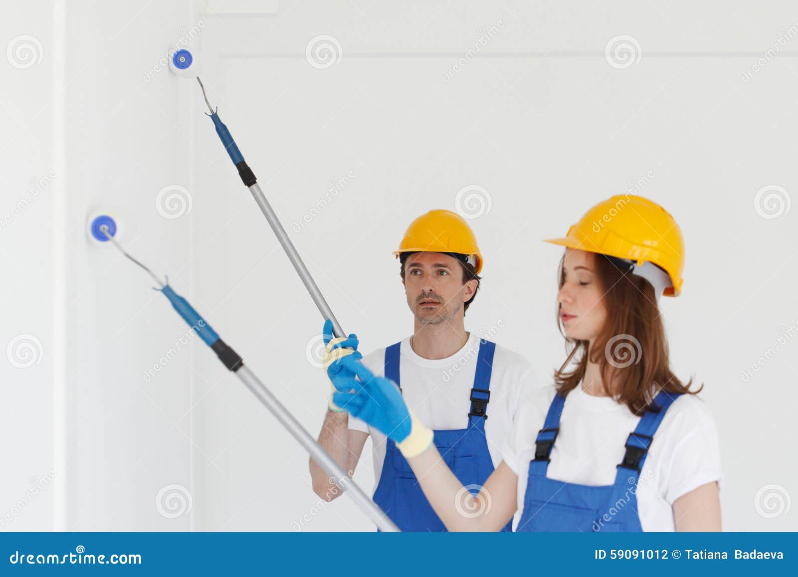 Workmen painting wall stock photo. Image of builder, industry - 59091012