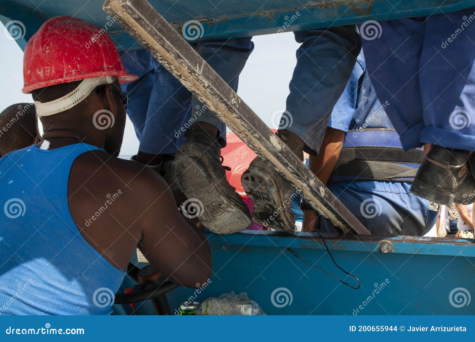 Workmen Sitting on a Crane Resting Editorial Stock Image - Image of ...