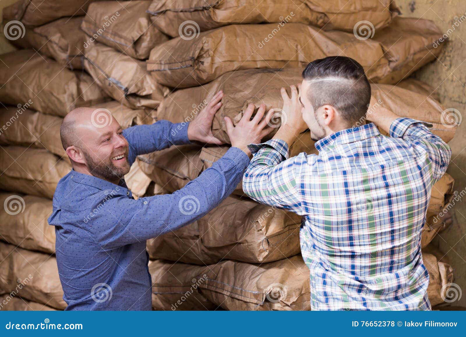 Workmen Unloading Shed with Coal Bags Stock Photo - Image of help ...