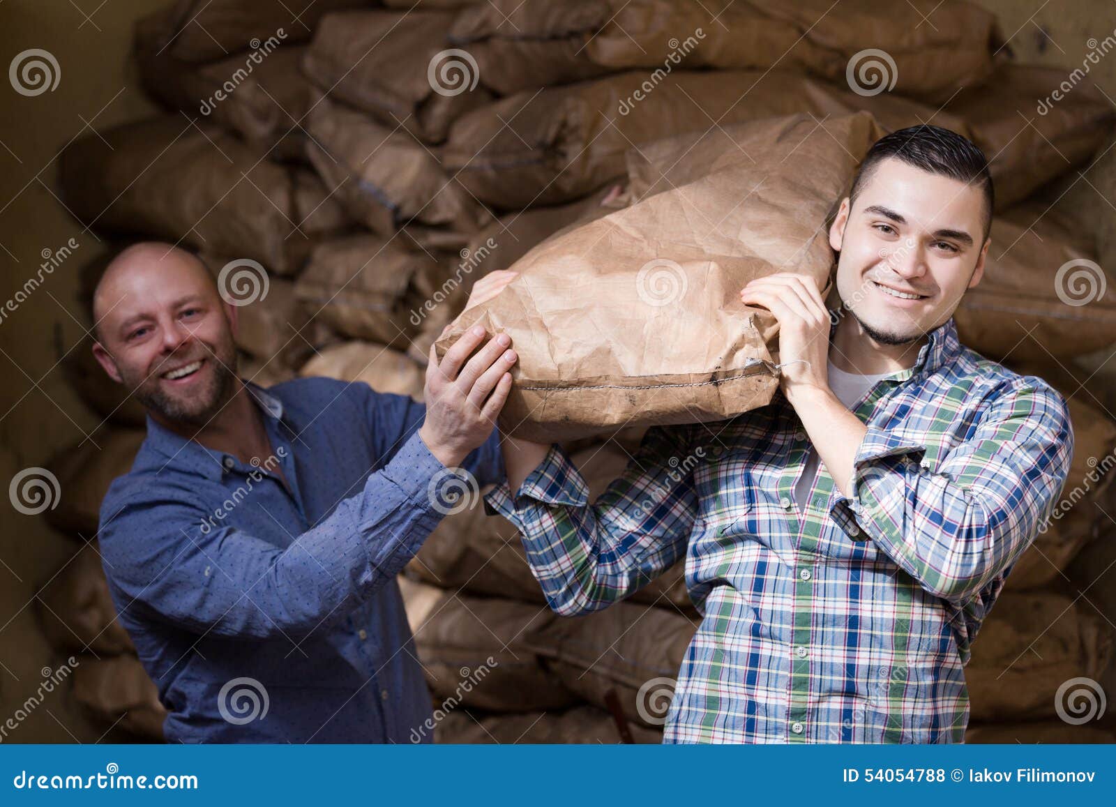 Workmen Unloading Shed with Coal Bags Stock Photo - Image of portrait ...