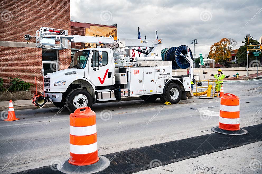 Workmen Verizon Lowering Cable into a Manhole (digital Composite ...