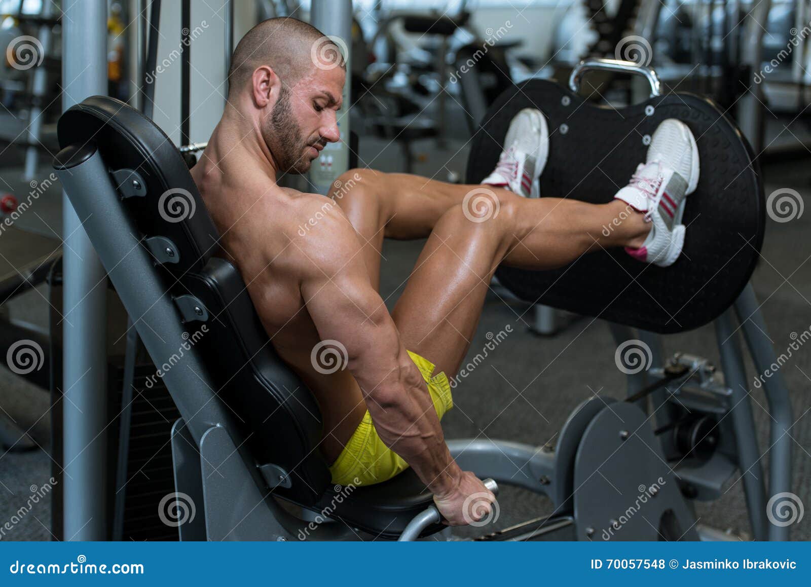 Workout Leg Press Exercises Stock Photo - Image of equipment, crouching ...