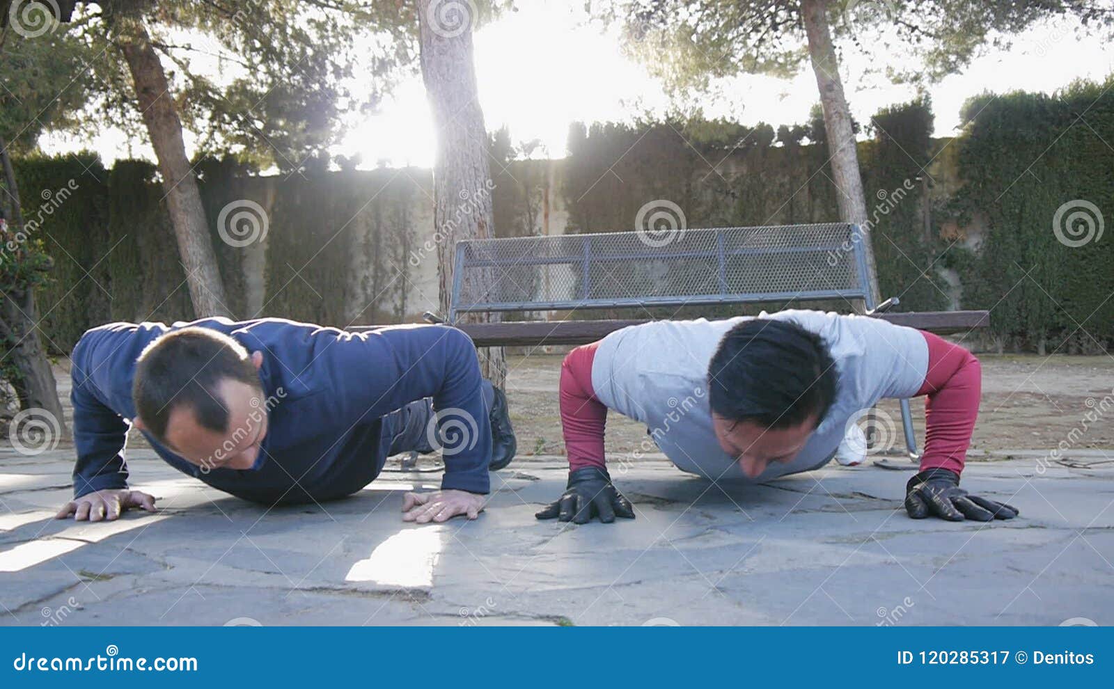 Workout with Personal Trainer Outdoors. Two Male Athletes Doing Offset ...