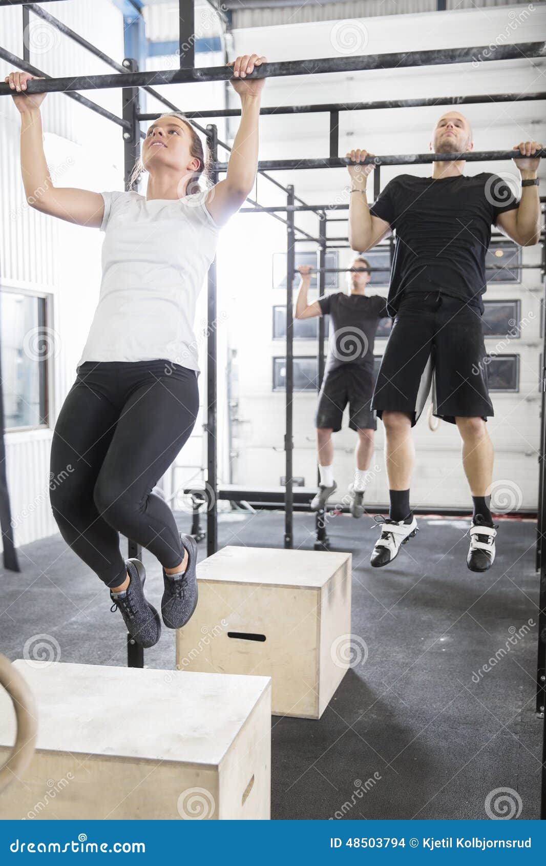 Workout Team Trains Pullups at Fitness Gym Stock Photo - Image of ...