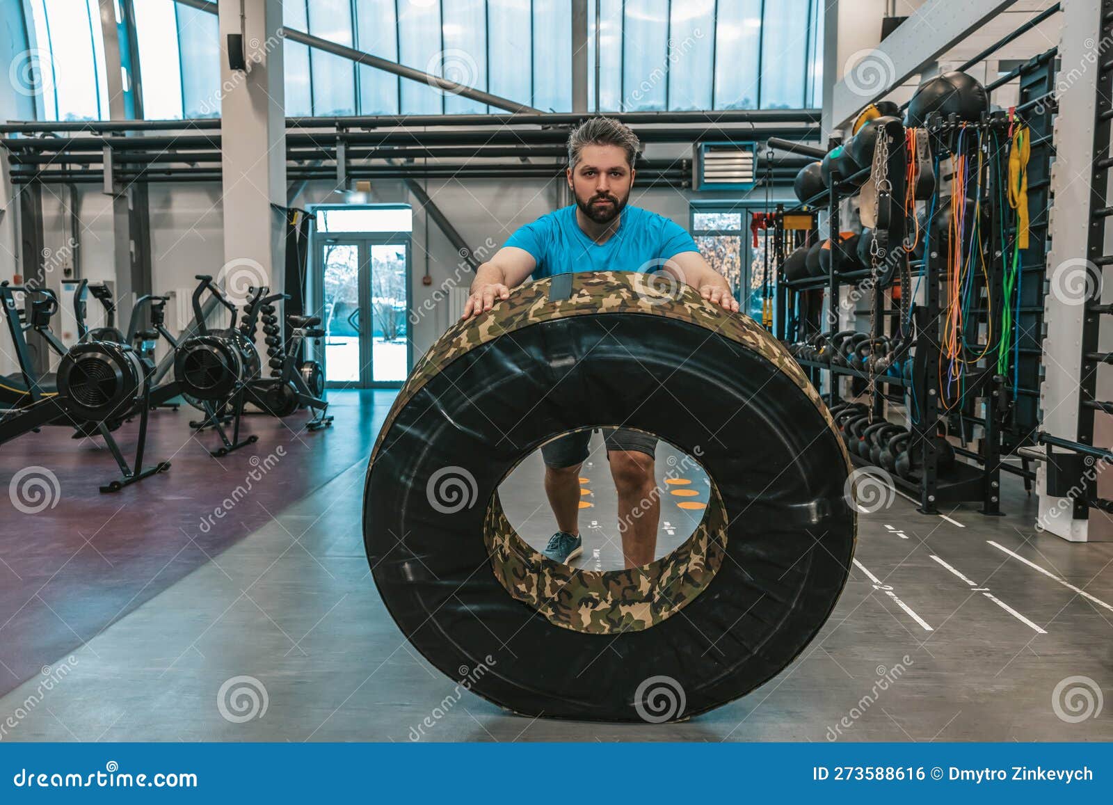 Athlete Rolling a Training Wheel and Looking Serious Stock Photo ...